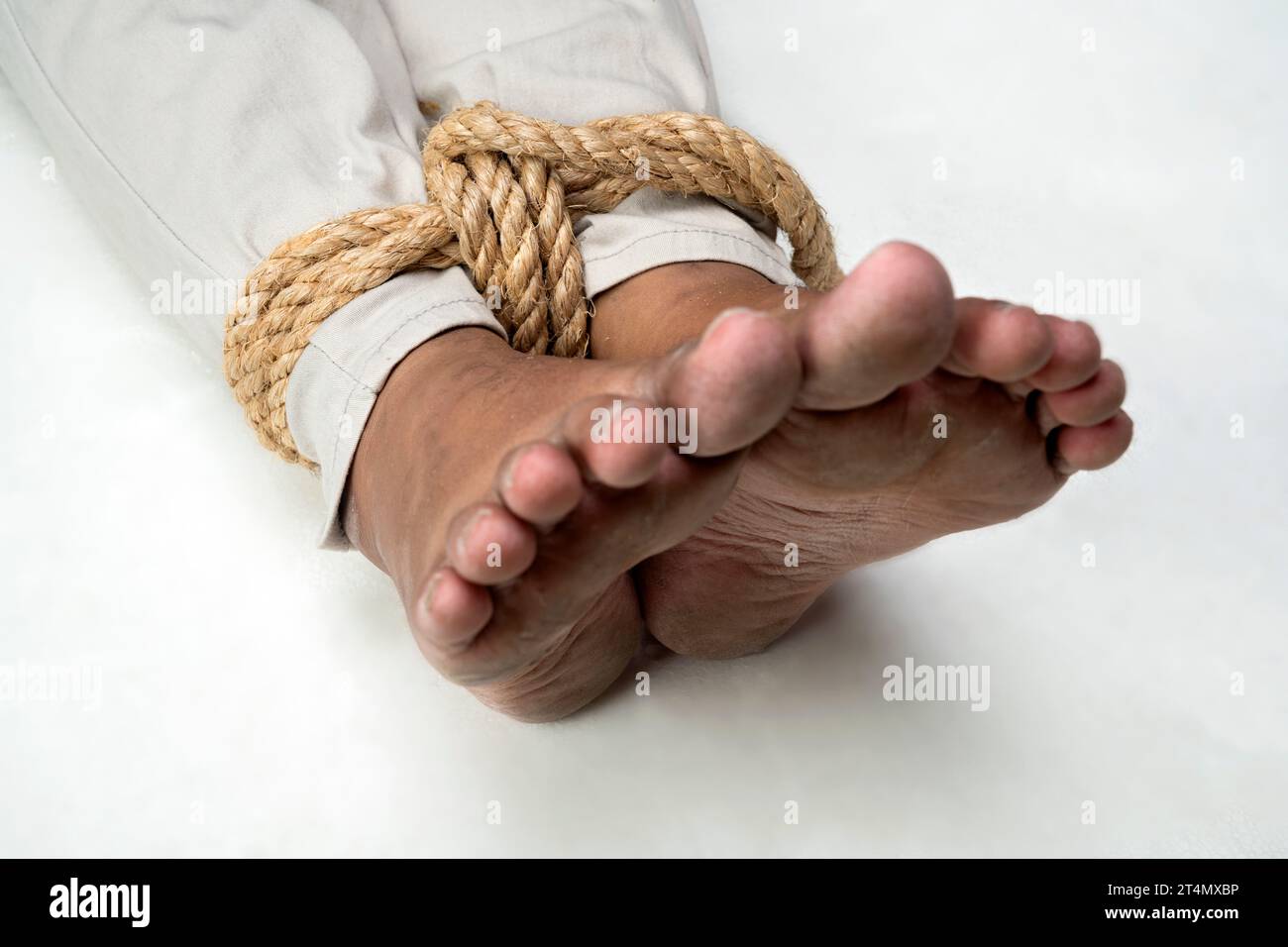 Legs tied rope hi-res stock photography and images - Alamy
