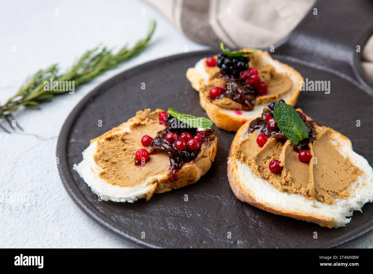 canapes with pate, mint leaves and berries, top view Stock Photo - Alamy