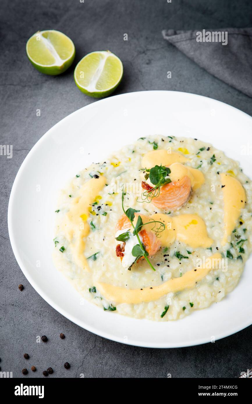white rice porridge with herbs and fish, side view Stock Photo - Alamy