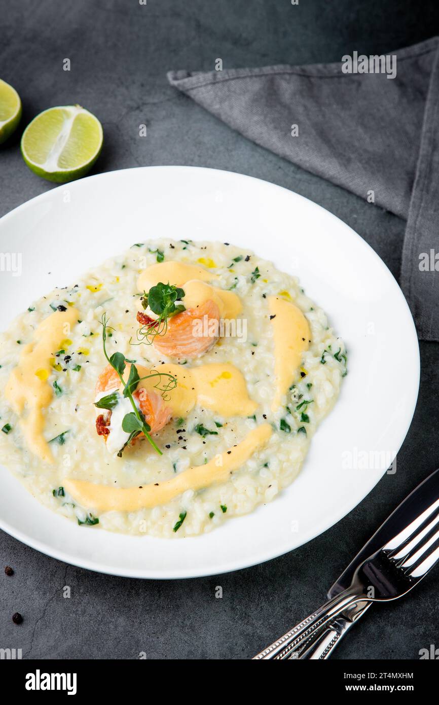 white rice porridge with herbs and fish, side view Stock Photo - Alamy