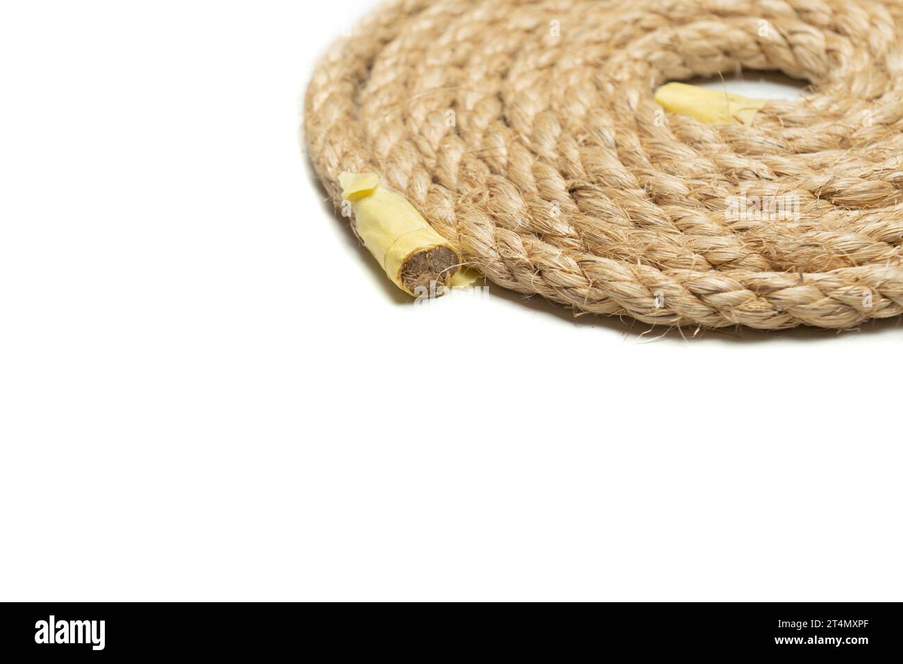 Coiled rope isolated over a white background Stock Photo - Alamy