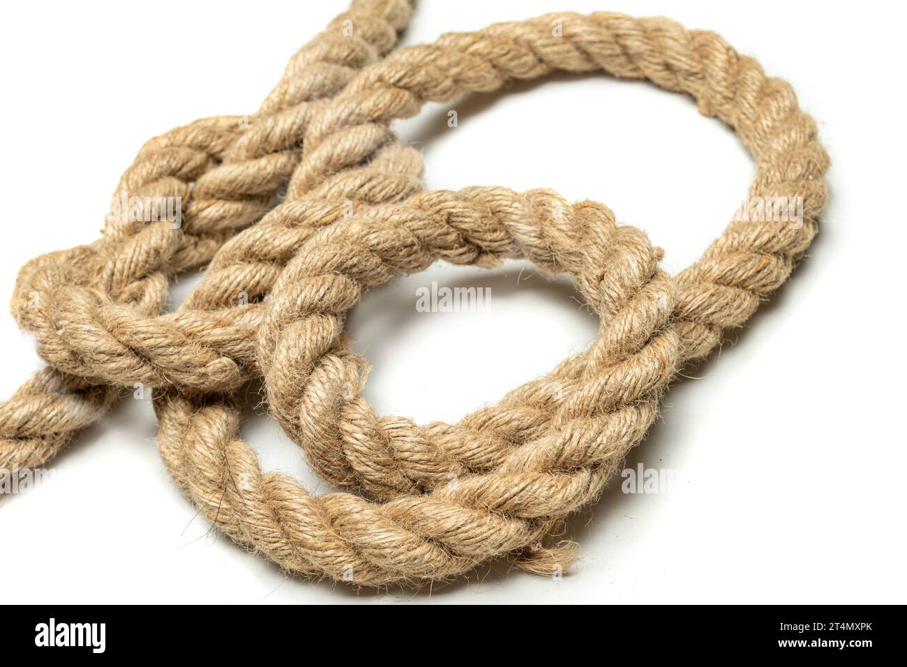 Coiled rope knot isolated over a white background Stock Photo - Alamy