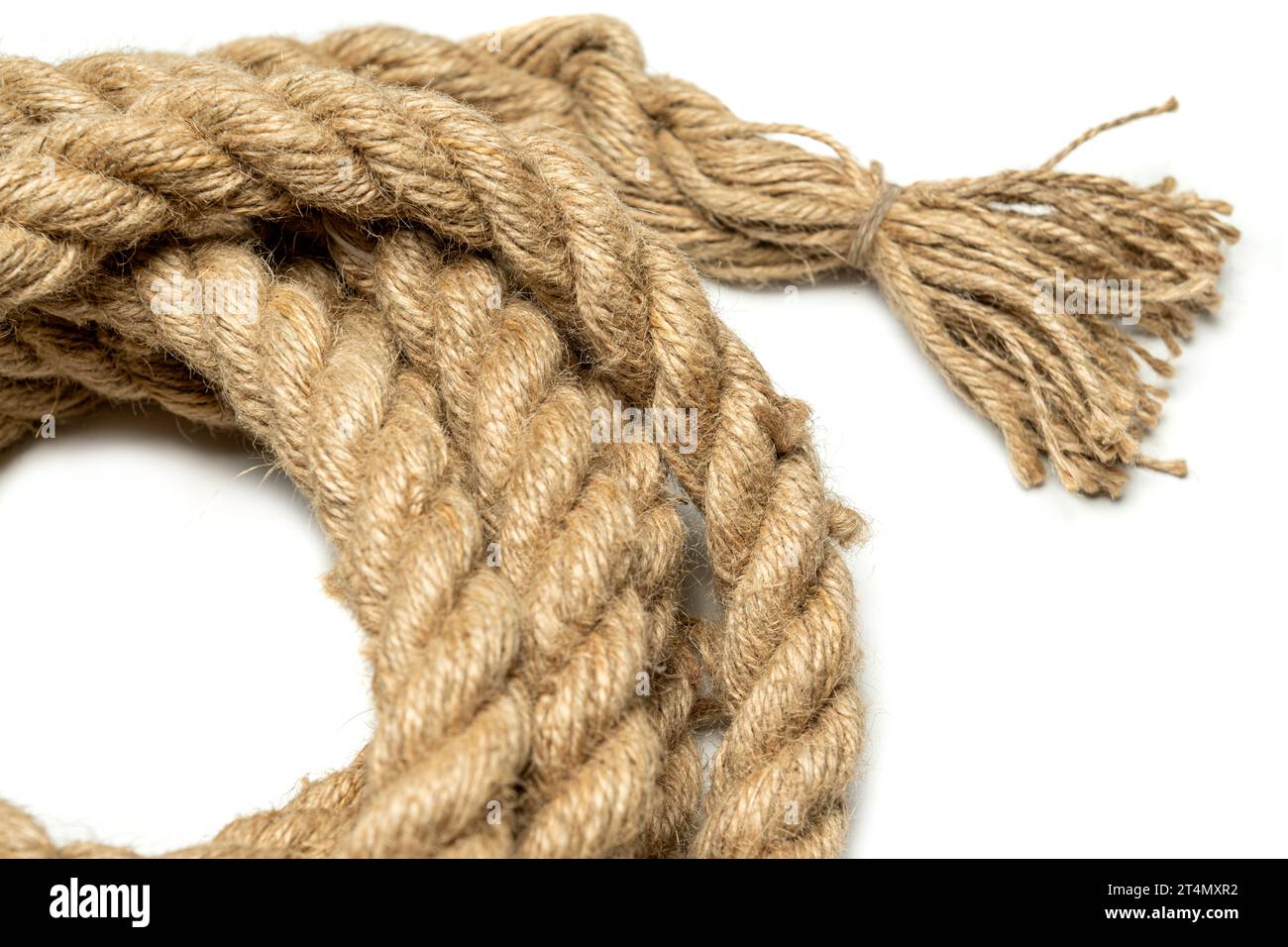 Coiled rope isolated over a white background Stock Photo - Alamy