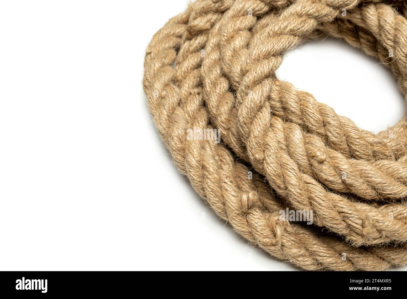 Coiled rope isolated over a white background Stock Photo - Alamy