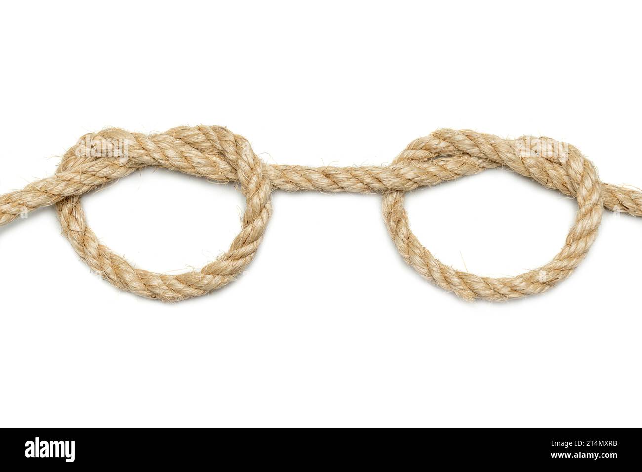Coiled rope knot isolated over a white background Stock Photo - Alamy