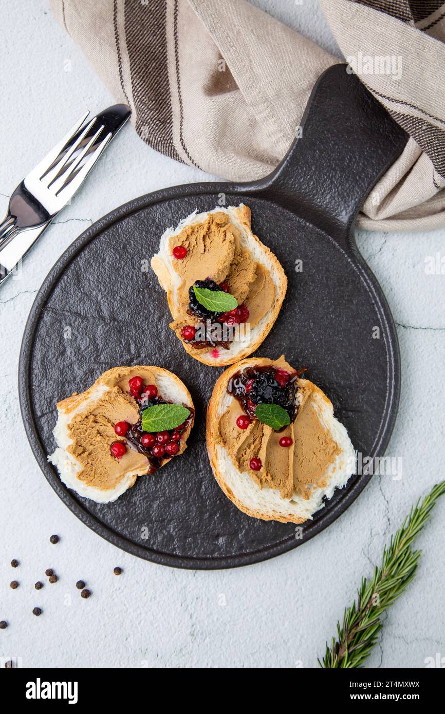 canapes with pate, mint leaves and berries, top view Stock Photo - Alamy