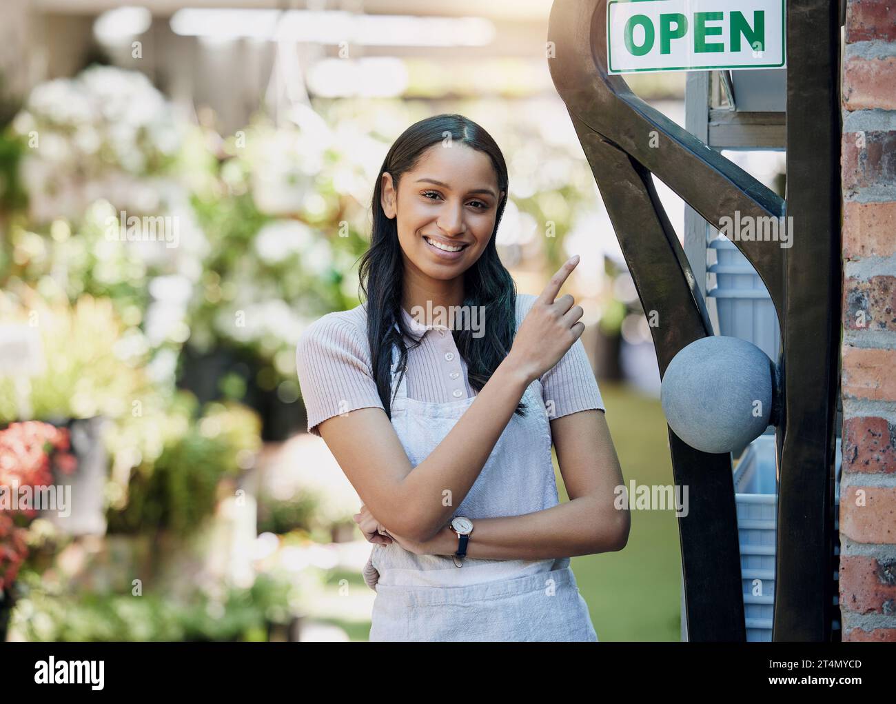 Motion to purchase. Portrait of a business owner holding an open sign ...