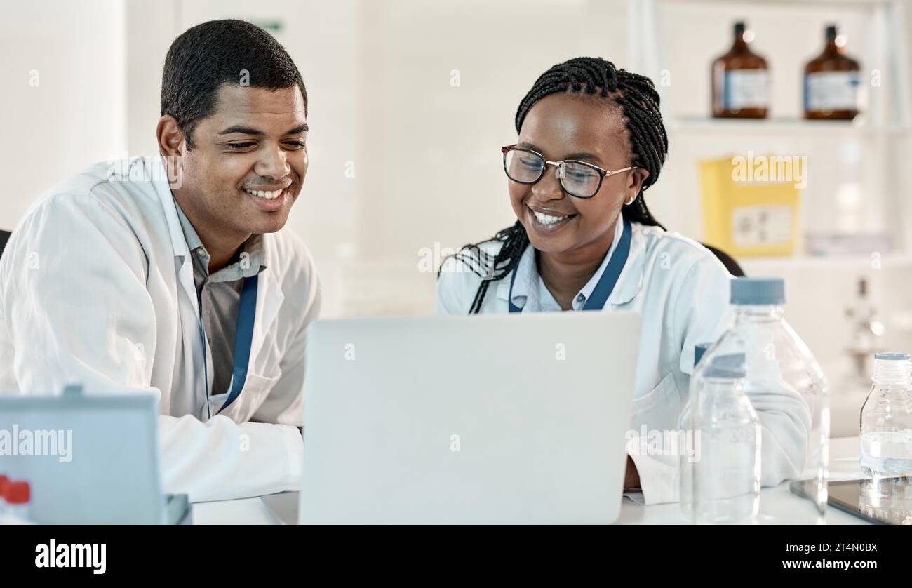 Making new discoveries as a team. two scientists working together on a ...