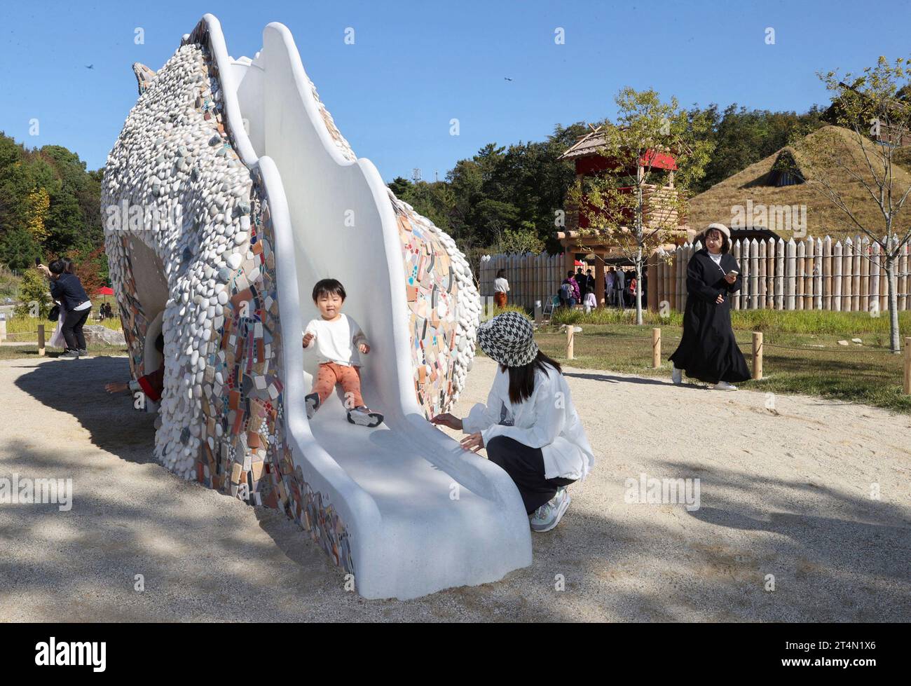 People visit the Mononoke Village area at Ghibli Park in Nagakute, Aich ...