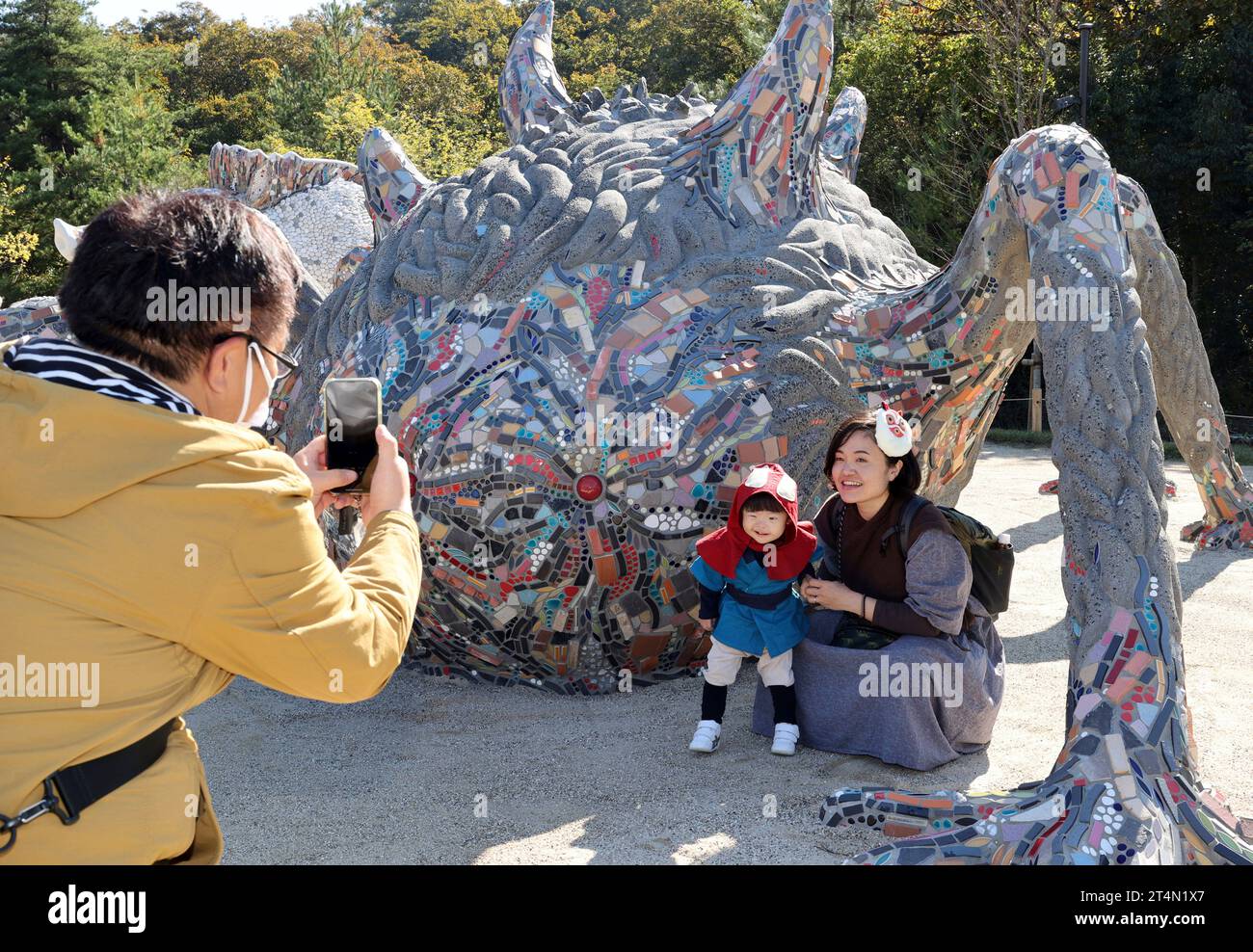 People visit the Mononoke Village area at Ghibli Park in Nagakute, Aich ...