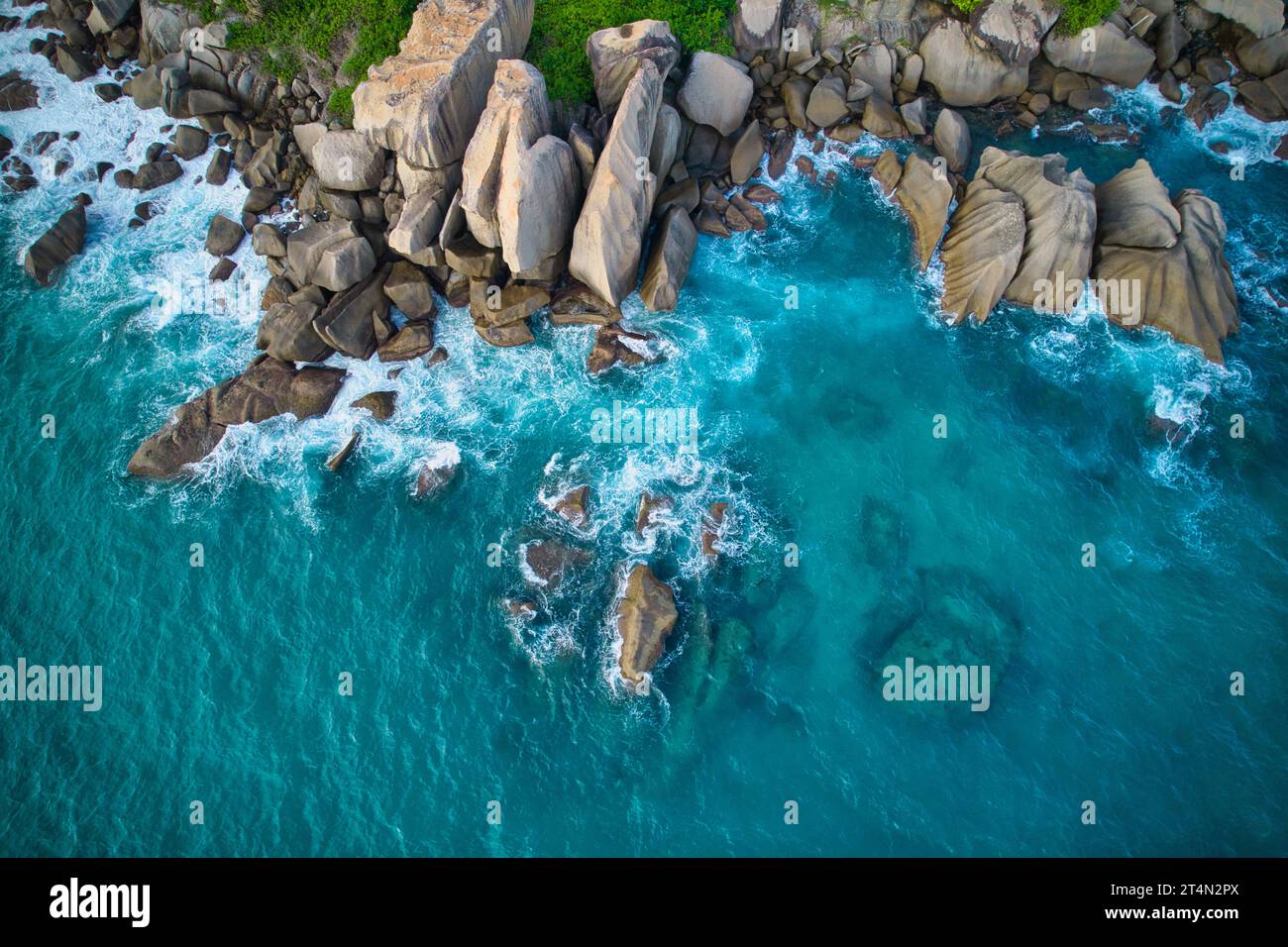 Bird eye drone shot of north east point beach, granite rocks, turquoise ...