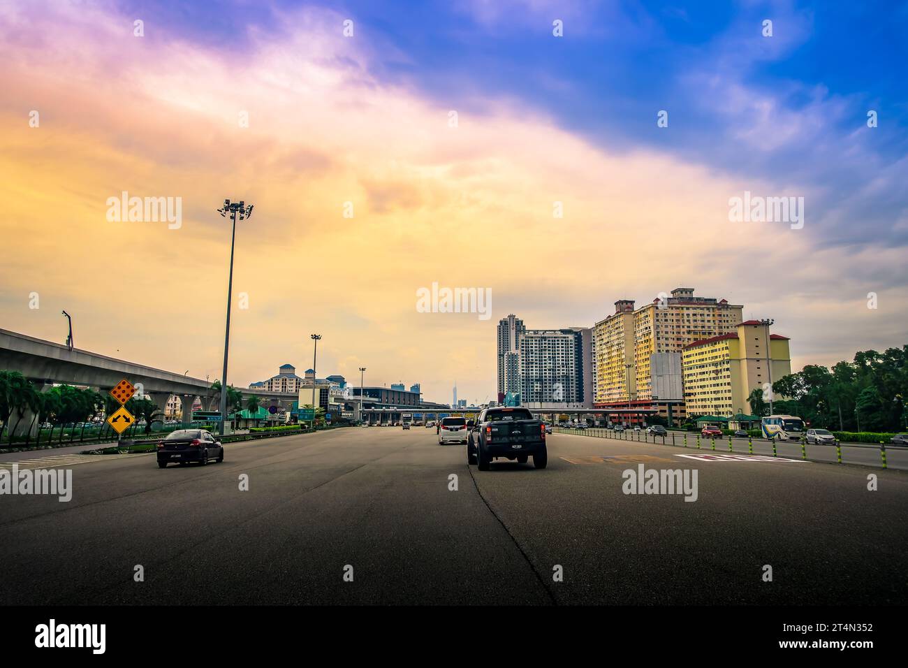 Cars approaching Toll gate, near Kuala Lumpur, at North South ...