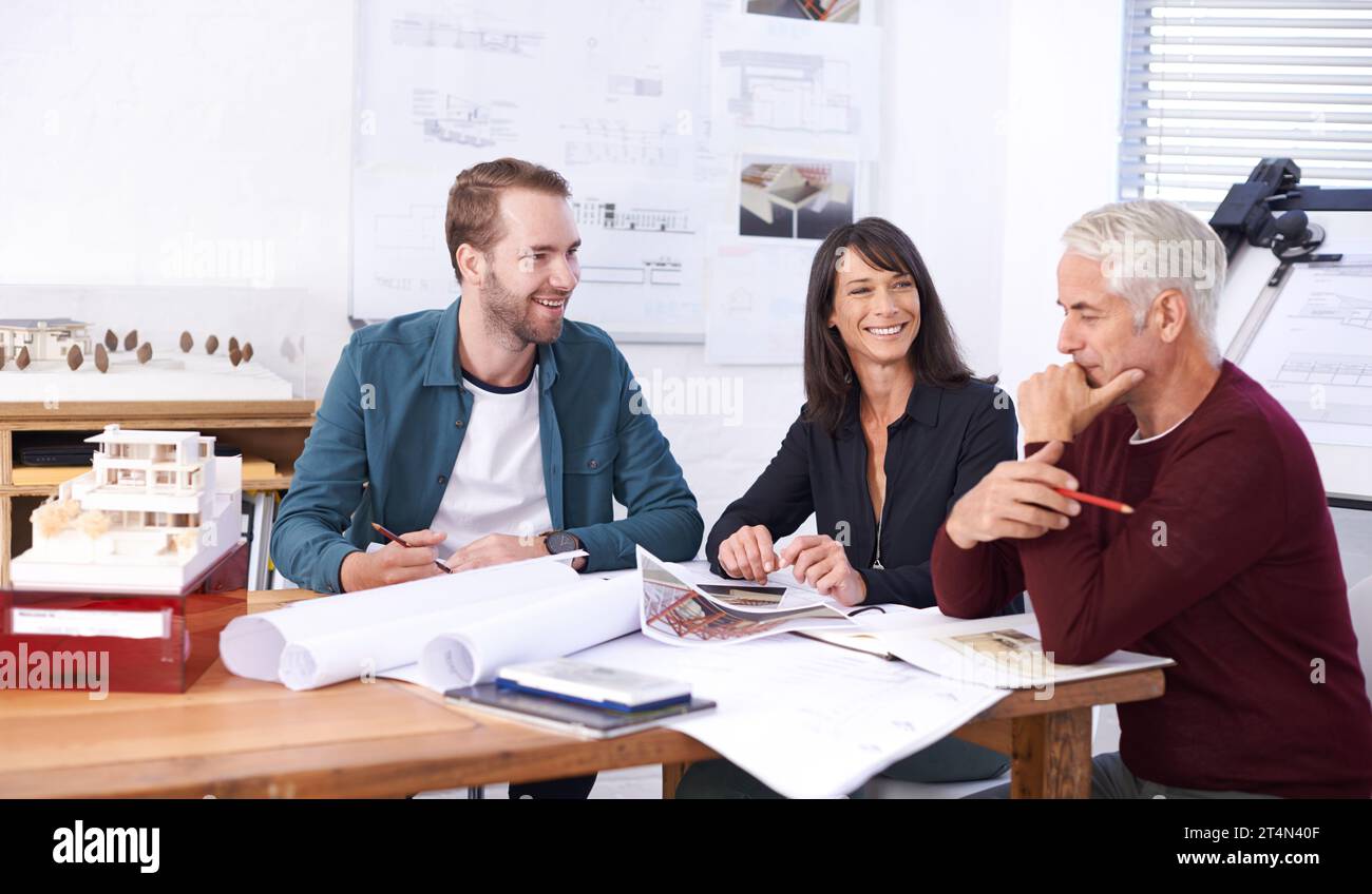 The architectural dream team. three architects working on a new ...