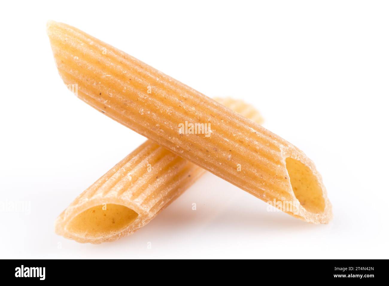 Wholemeal Pasta Penne as close-up shot isolated on white background ...