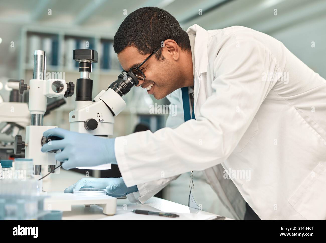 Smiling scientist looks in hi-res stock photography and images - Alamy