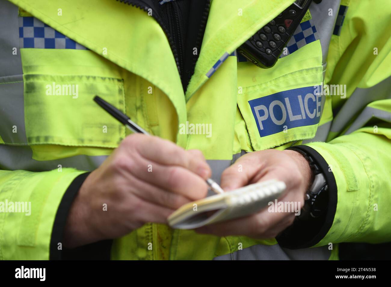 File photo dated 22/10/14 of a police officer making notes. The ...