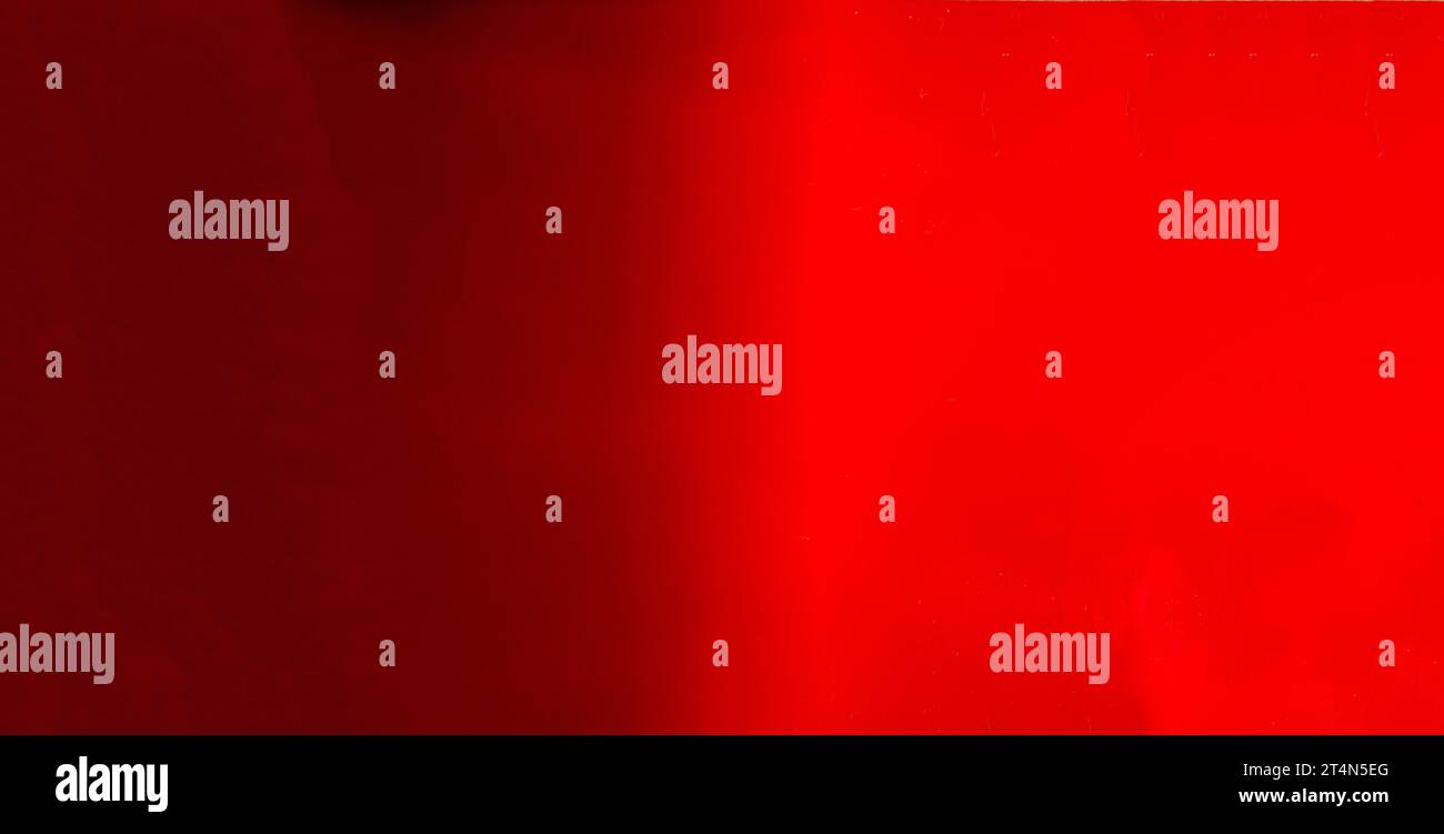 Red solid color background with light pattern as photo Stock Photo - Alamy