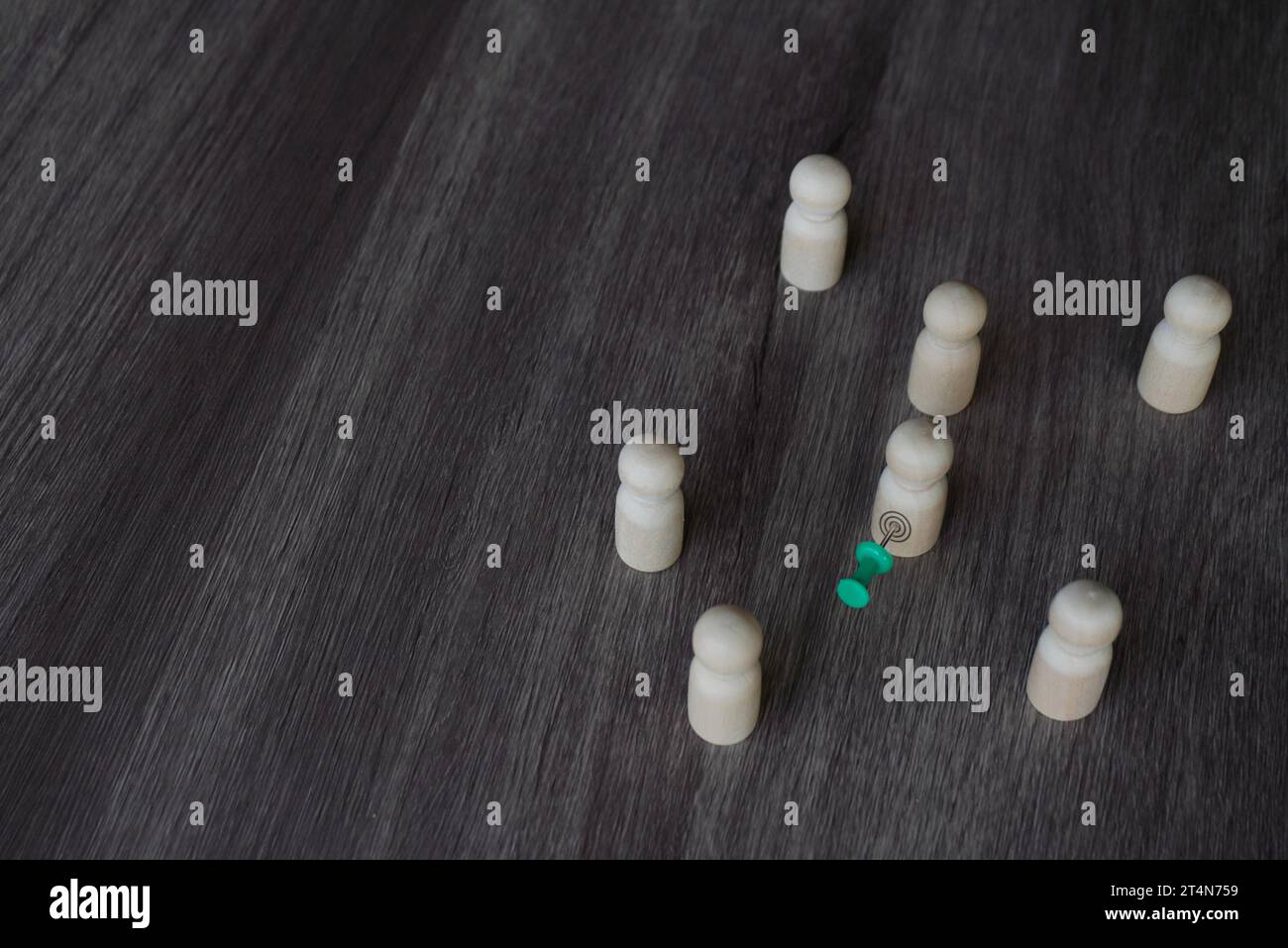 Wooden dolls and pushpin. Target customer, target market and potential ...