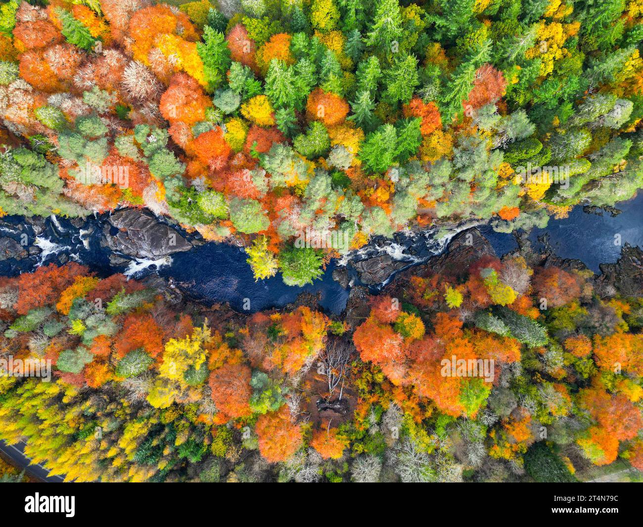 Aerial view of River Moriston surrounded by woodland looking ...
