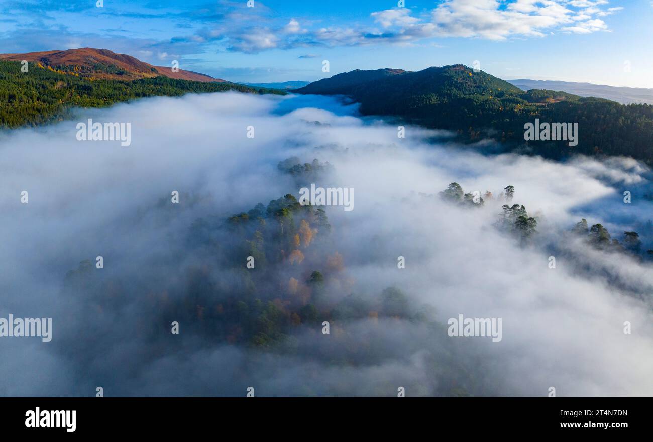 Aerial views of autumnal colours over Loch Beinn a Mheadhoin with early ...