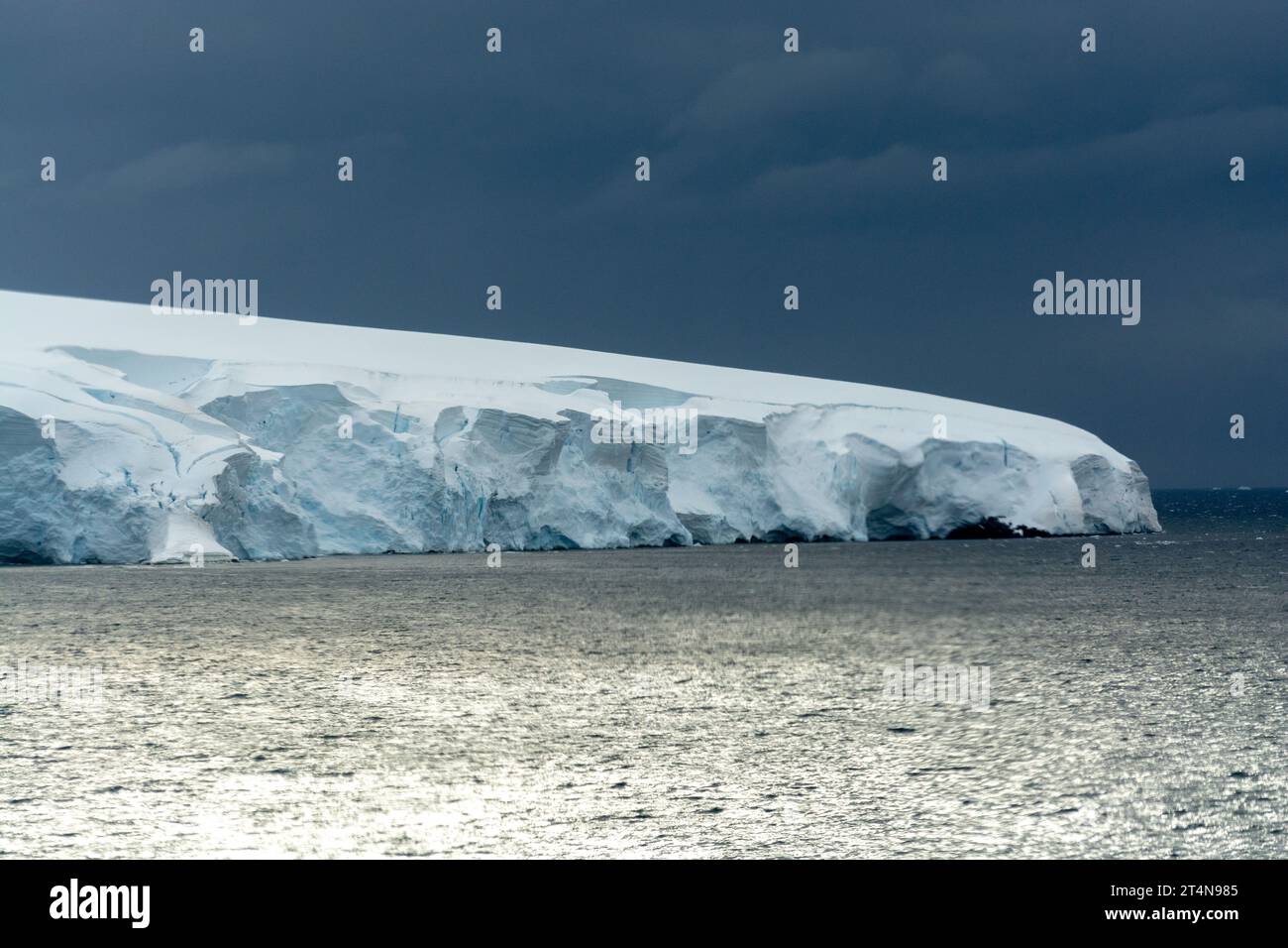 ice cliffs on edge of snow covered island. antarctic peninsula ...