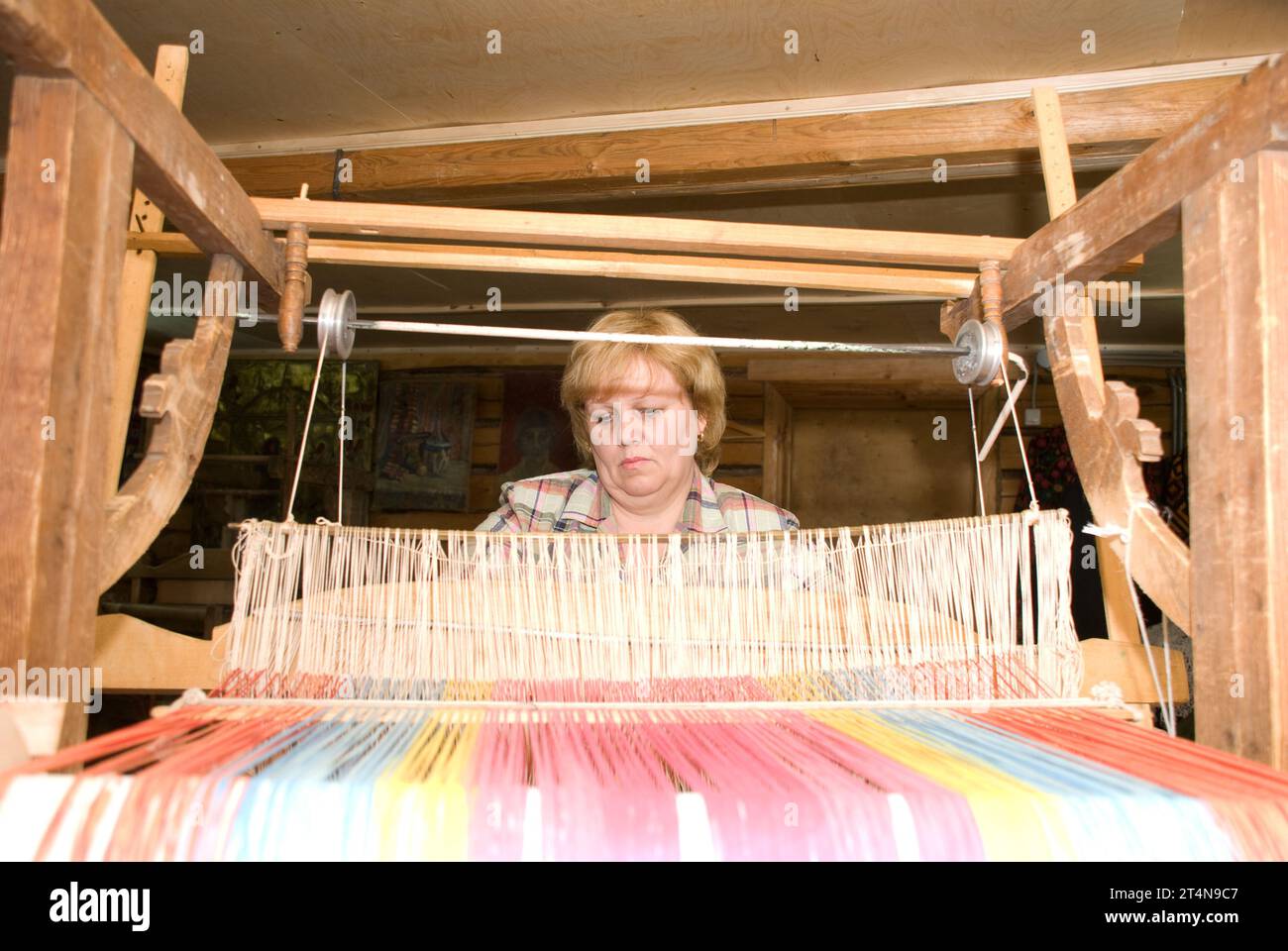 Weaver at the old loom Stock Photo - Alamy
