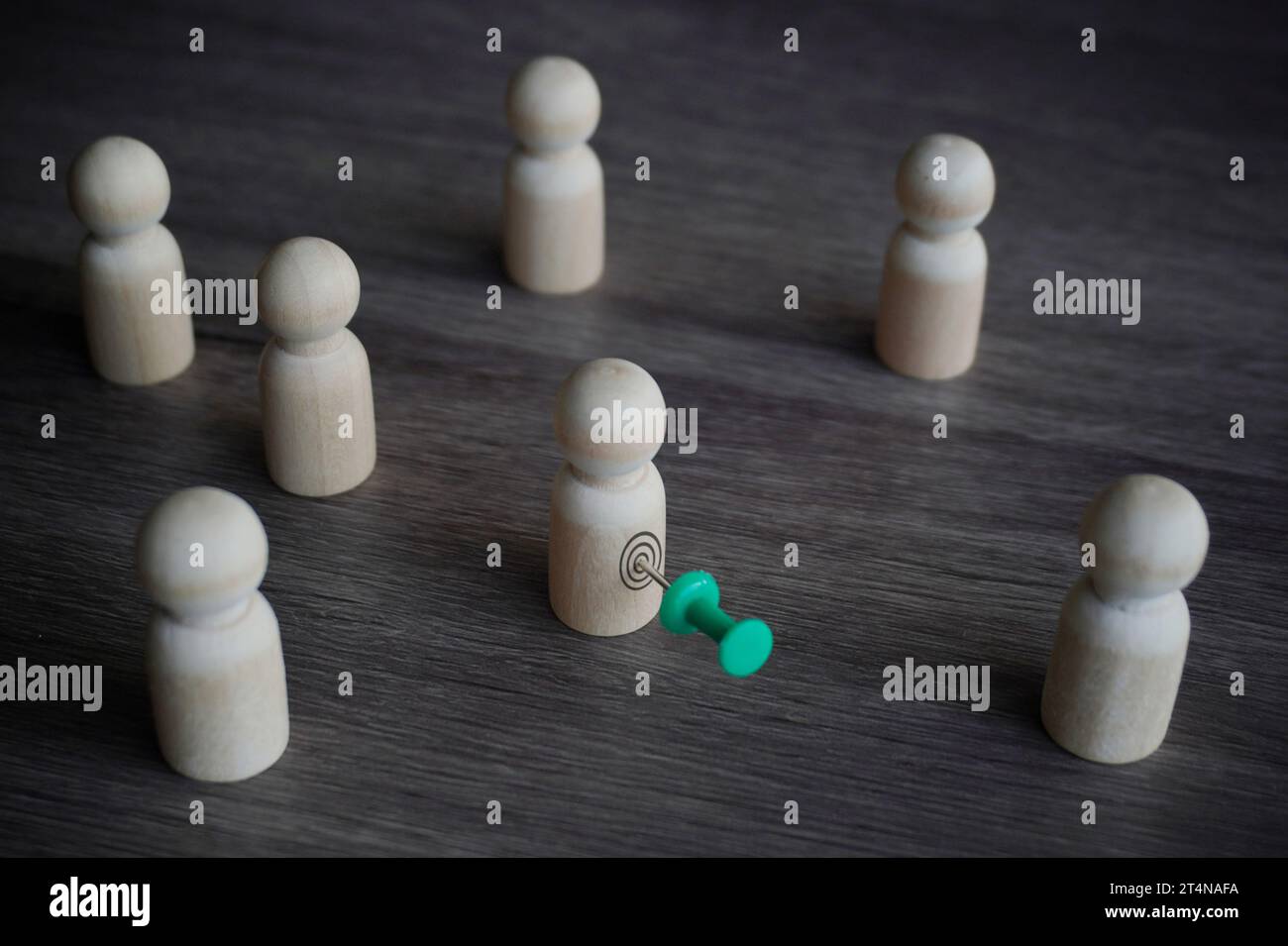 Wooden dolls and pushpin. Target customer, target market and potential ...