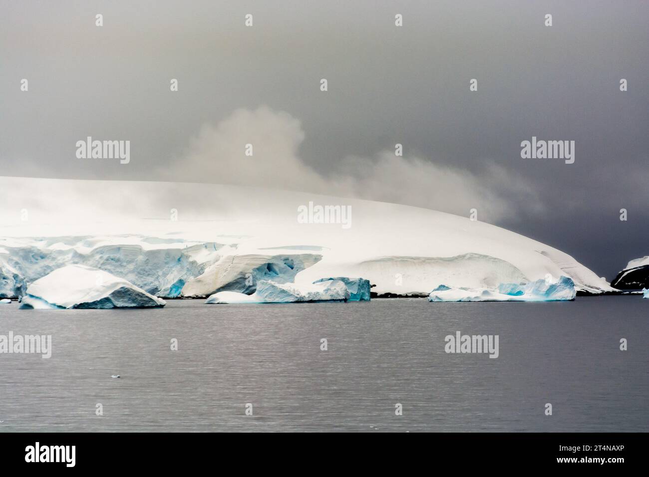 snow covered icy coastline of hughes bay. danco coast. antarctic ...
