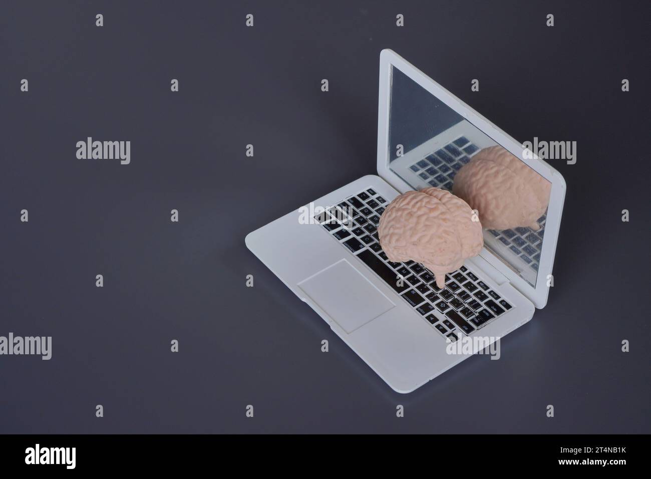 Human brain on top of laptop with copy space. Artificial intelligence ...