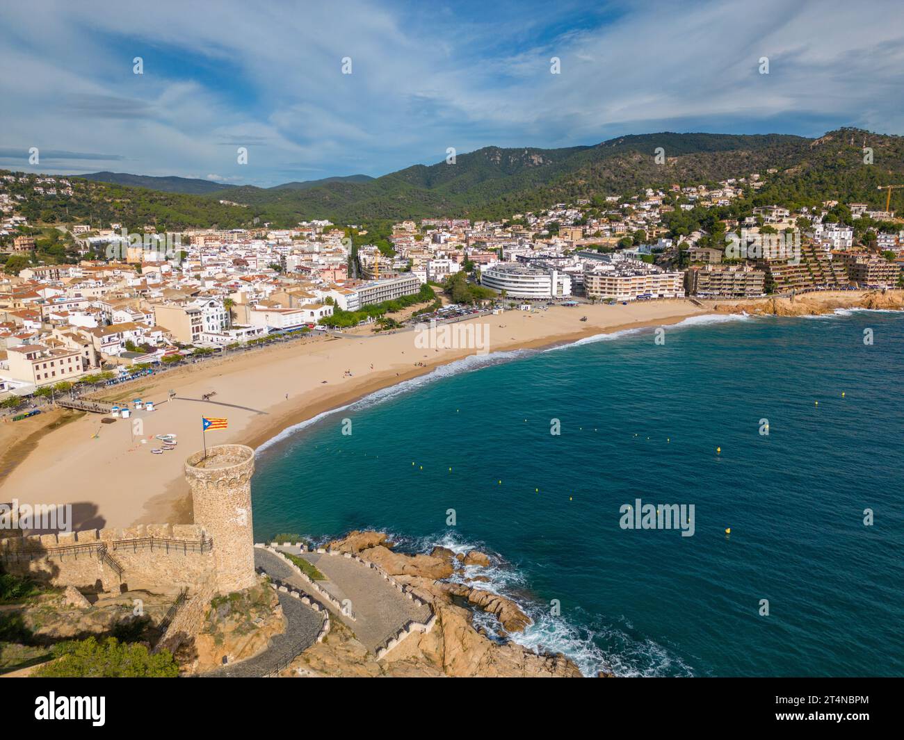 Aerial drone view of the coastal town named Tossa de Mar with a beach ...