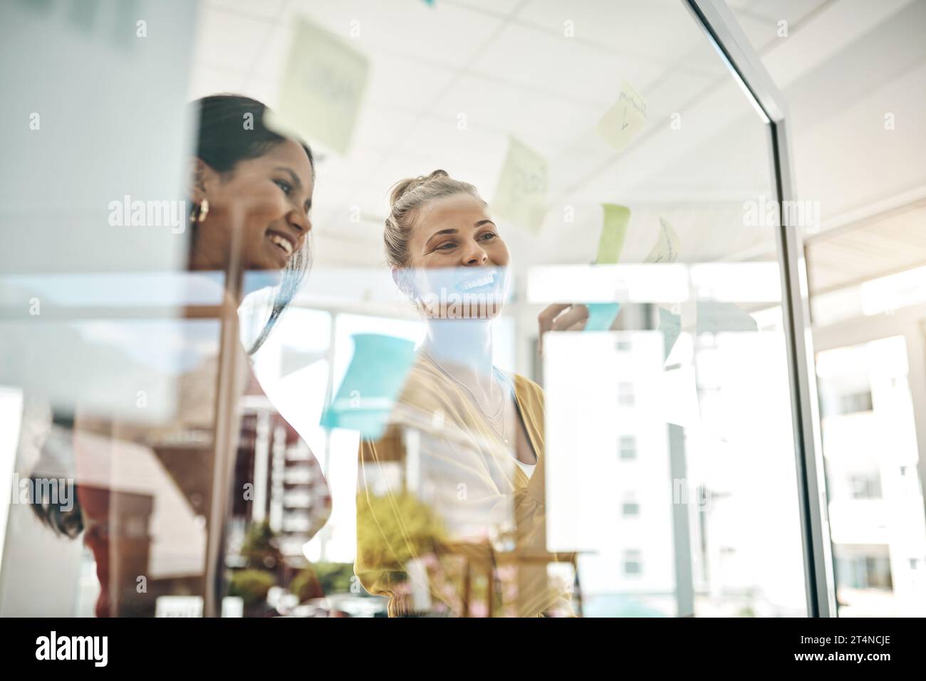 Laying out a timeline of anticipated profits. two businesswomen ...