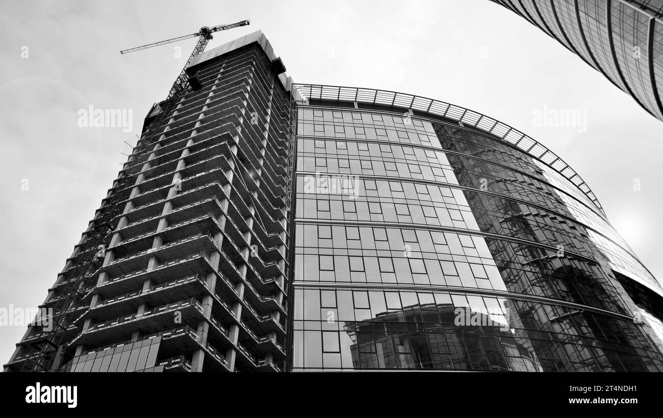 View of a skyscraper under construction. Modern architecture background ...