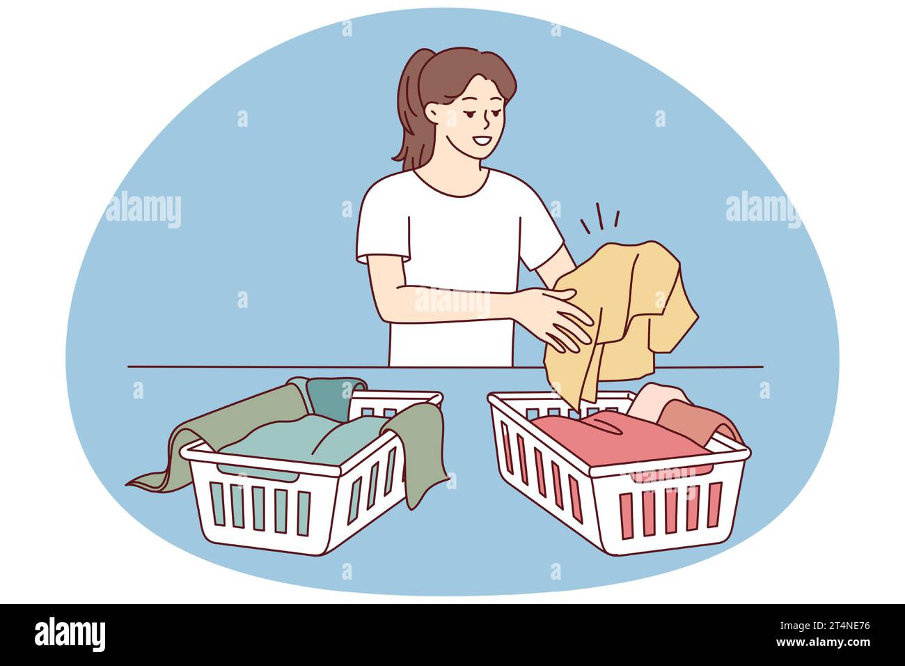 Woman sorting dirty clothes for washing. Girl gathering laundry in ...