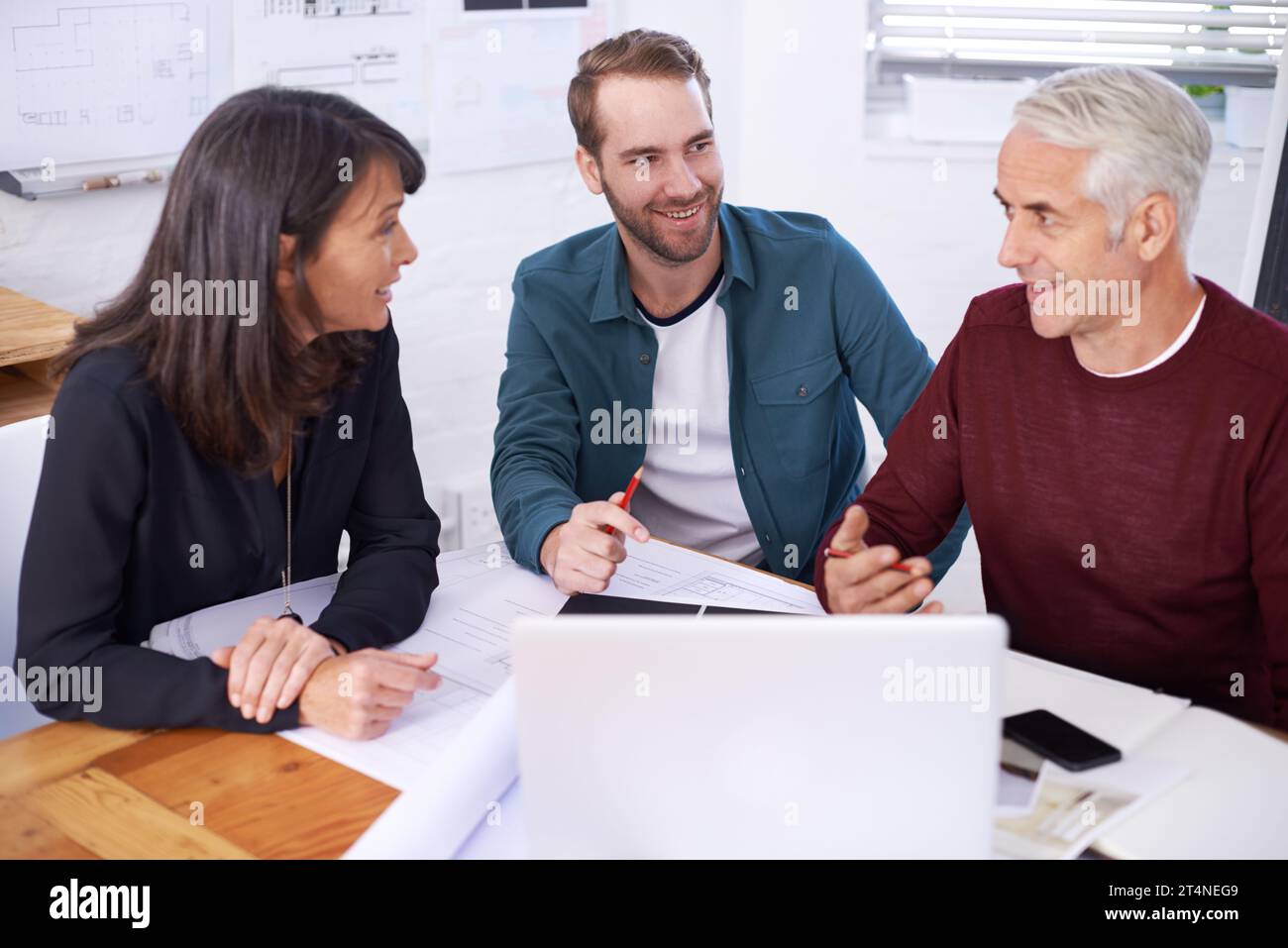 The architectural dream team. three architects working on a new ...