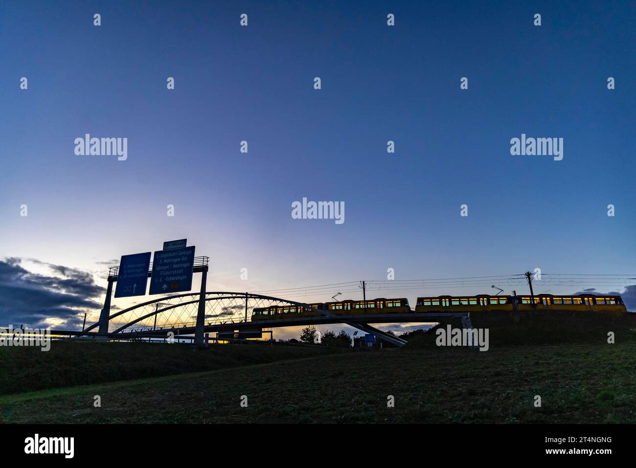 Network arch bridge over the A8 motorway. Light rail bridge of the SSB ...