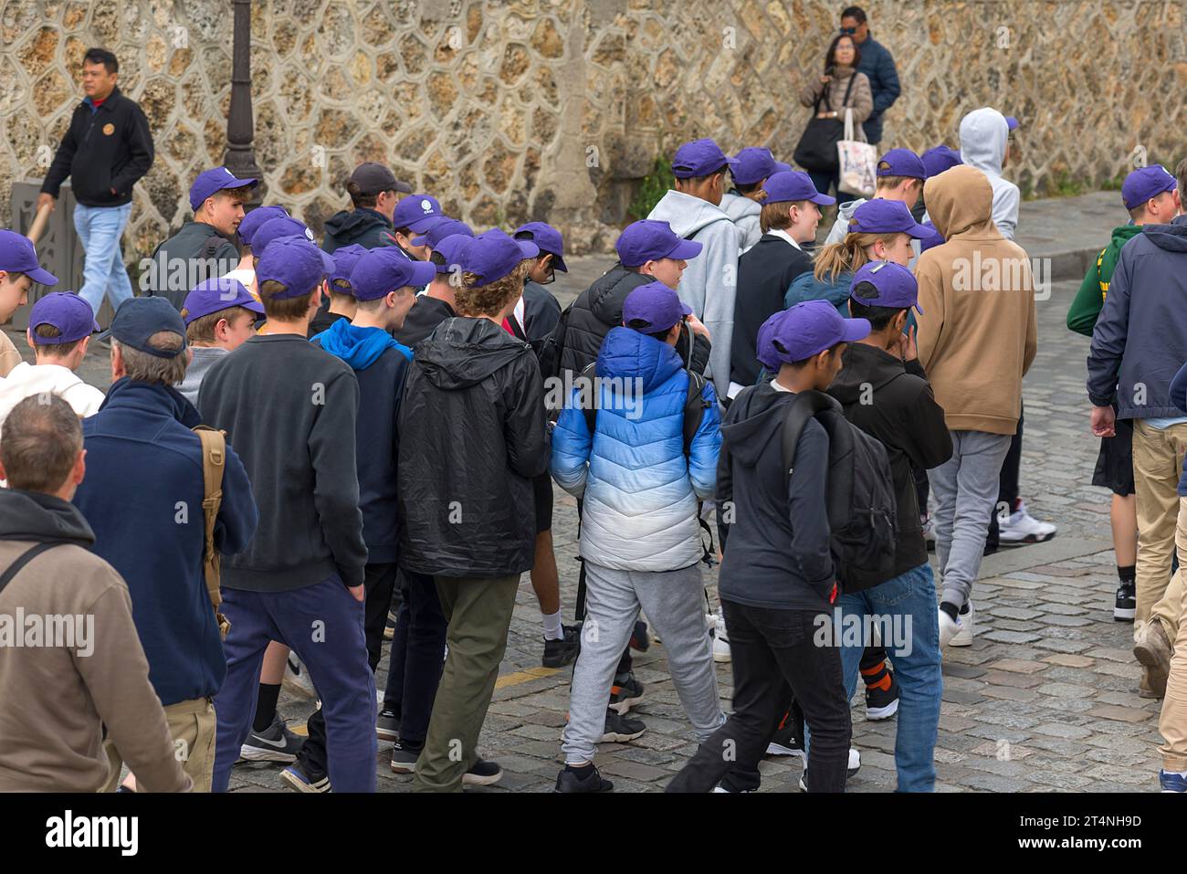 School class with blue caps visit Monmarte, Paris, France Stock Photo ...