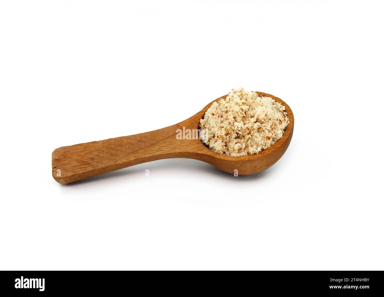 Shelled and ground Ground, milled, crushed almond nuts in a wooden ...
