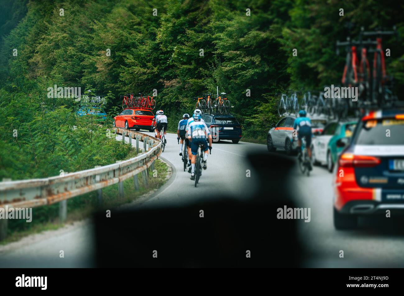 Convoy of cars in cycling race. Preparation for professional race in ...