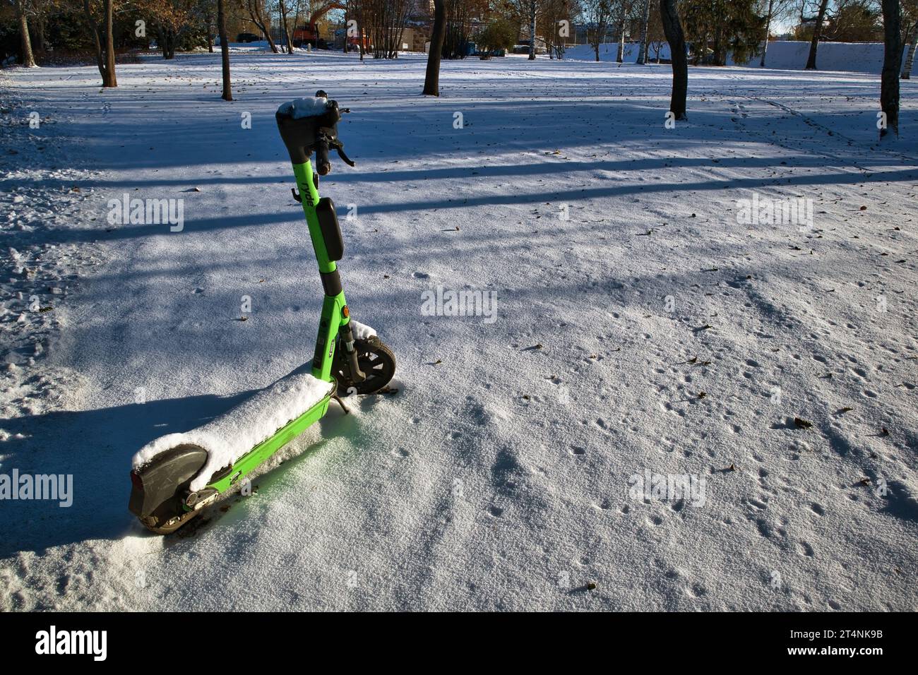 electric scooter abandoned in snow Stock Photo - Alamy