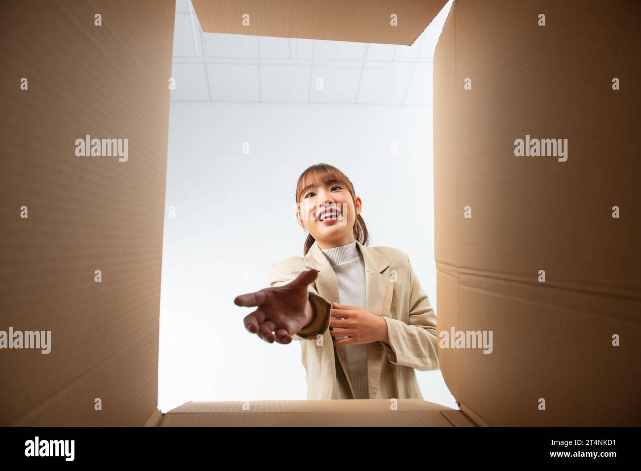 Joyful female customer satisfied with fast delivery service, getting ...