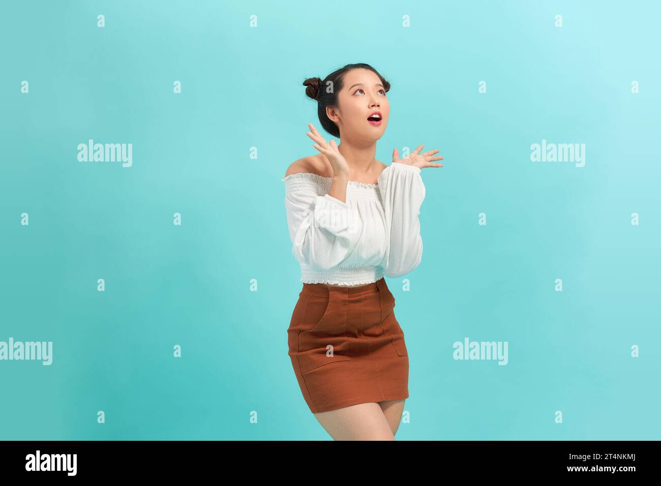 Excited asian woman shout out loud wow with hands on isolated ...