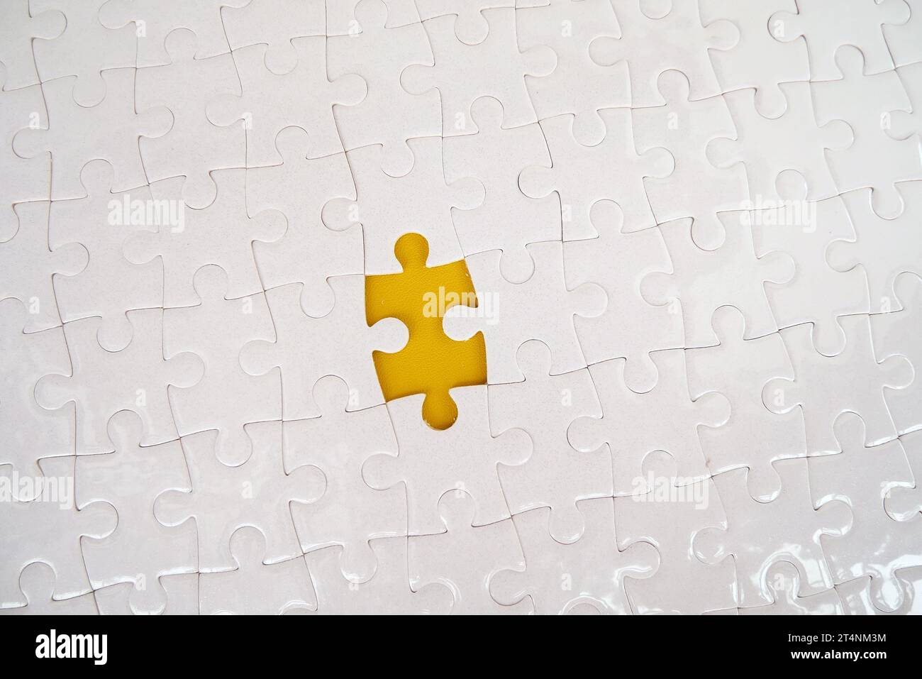 White details of the puzzle on a yellow background. White jigsaw puzzle ...