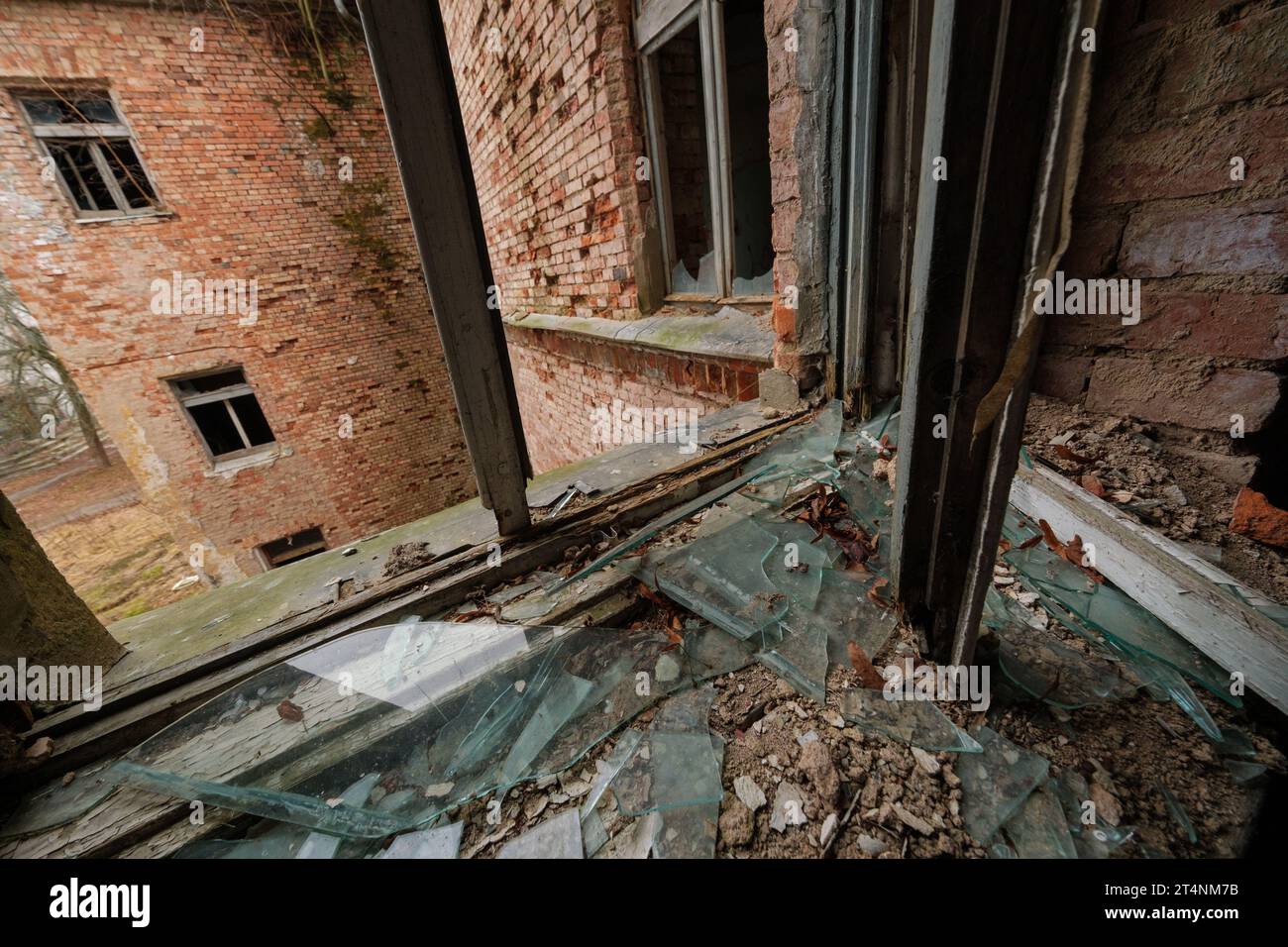 From above metal frame window sill on upstairs with broken transparent ...