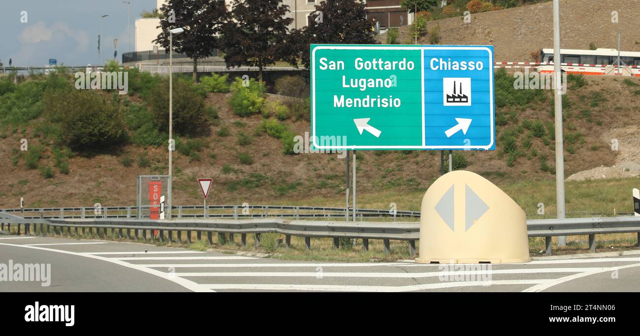 road signs for the cities of Lugano and the San Gottardo border and the ...