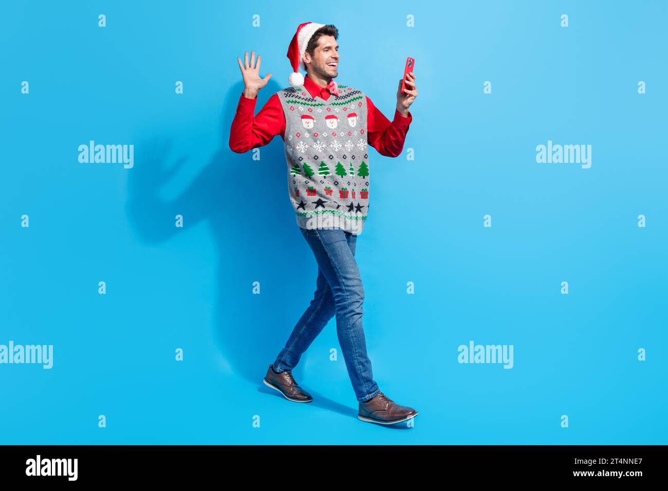 Full size photo of nice person dressed santa hat walk empty space say ...