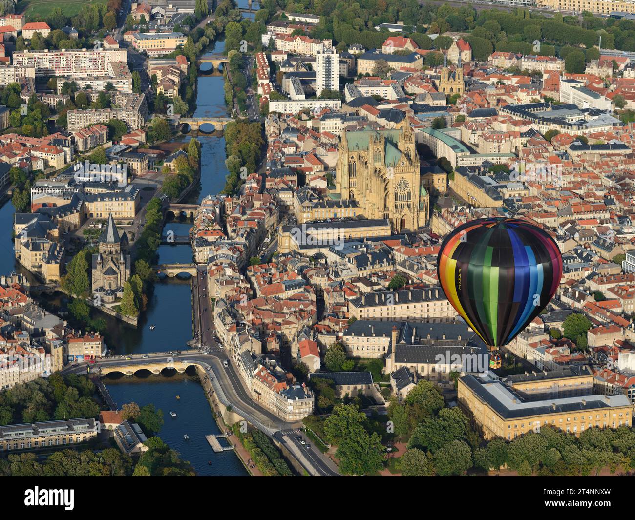 AIR-TO-AIR VIEW. Hot-air balloon drifting above the city of Metz ...