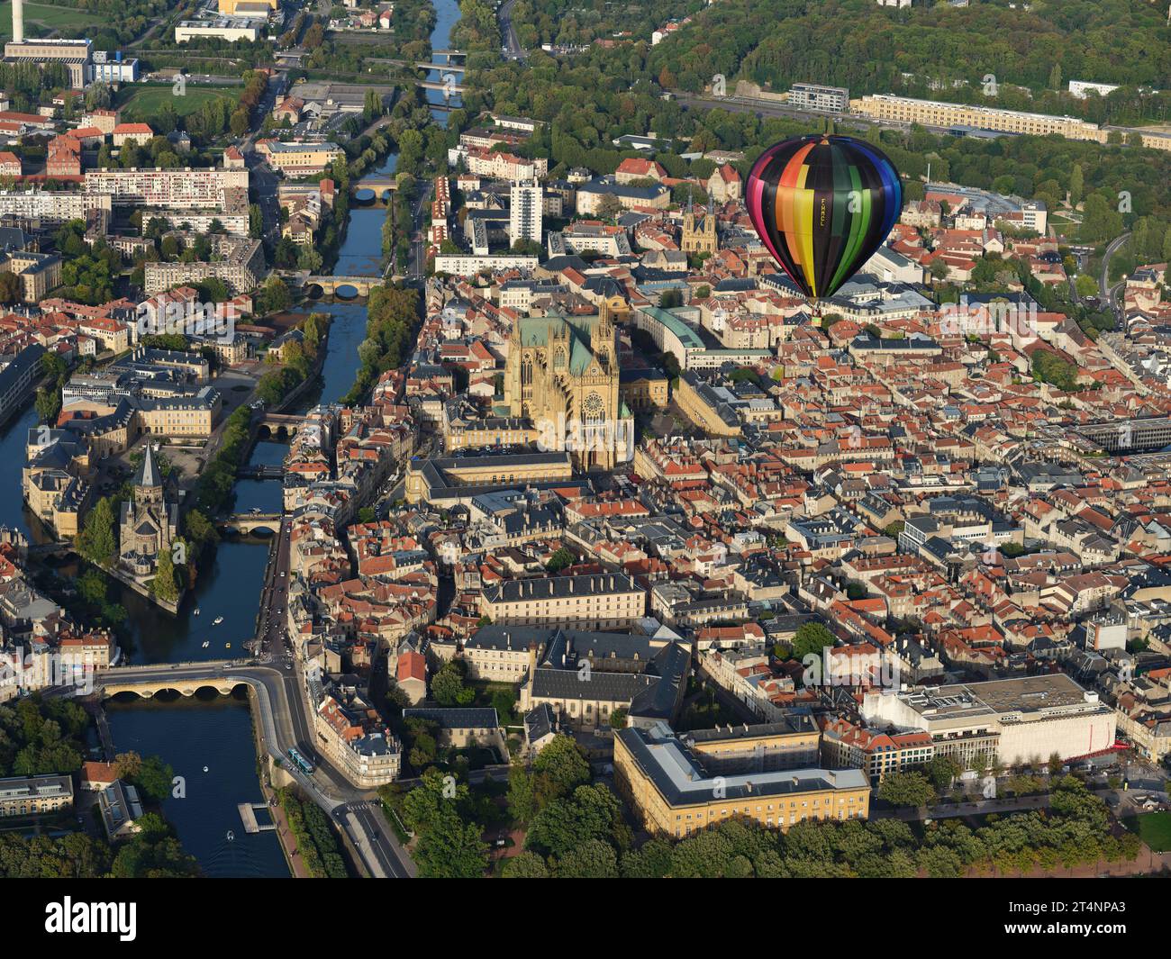 AIR-TO-AIR VIEW. Hot-air balloon drifting above the city of Metz ...