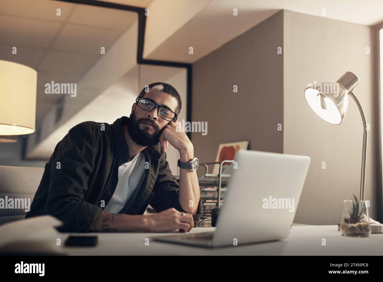 Focus flew right out the window. a young businessman looking uncertain ...