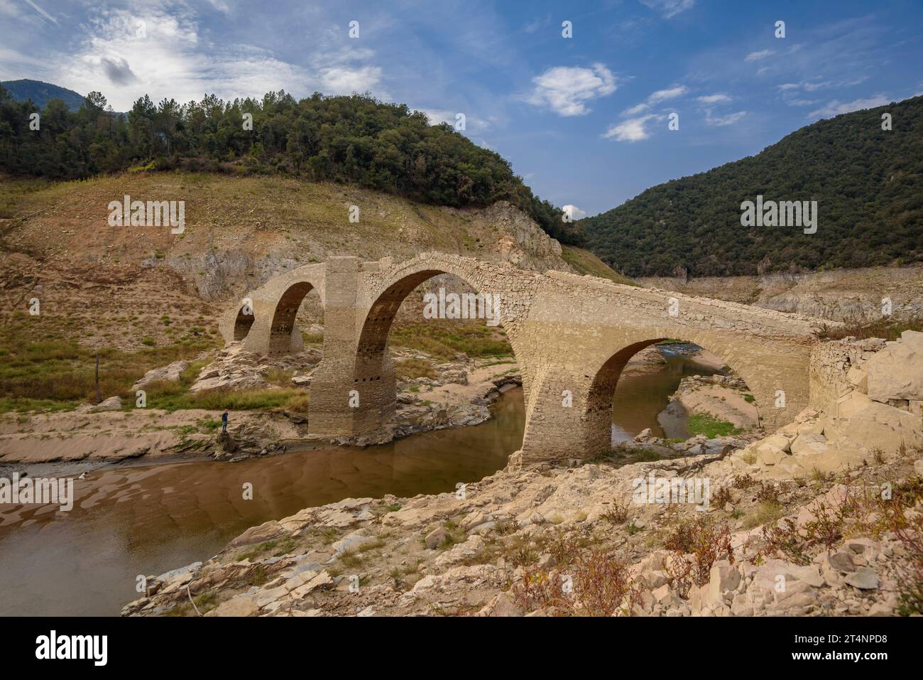 Querós Bridge, an old medieval bridge submerged under the water of the ...