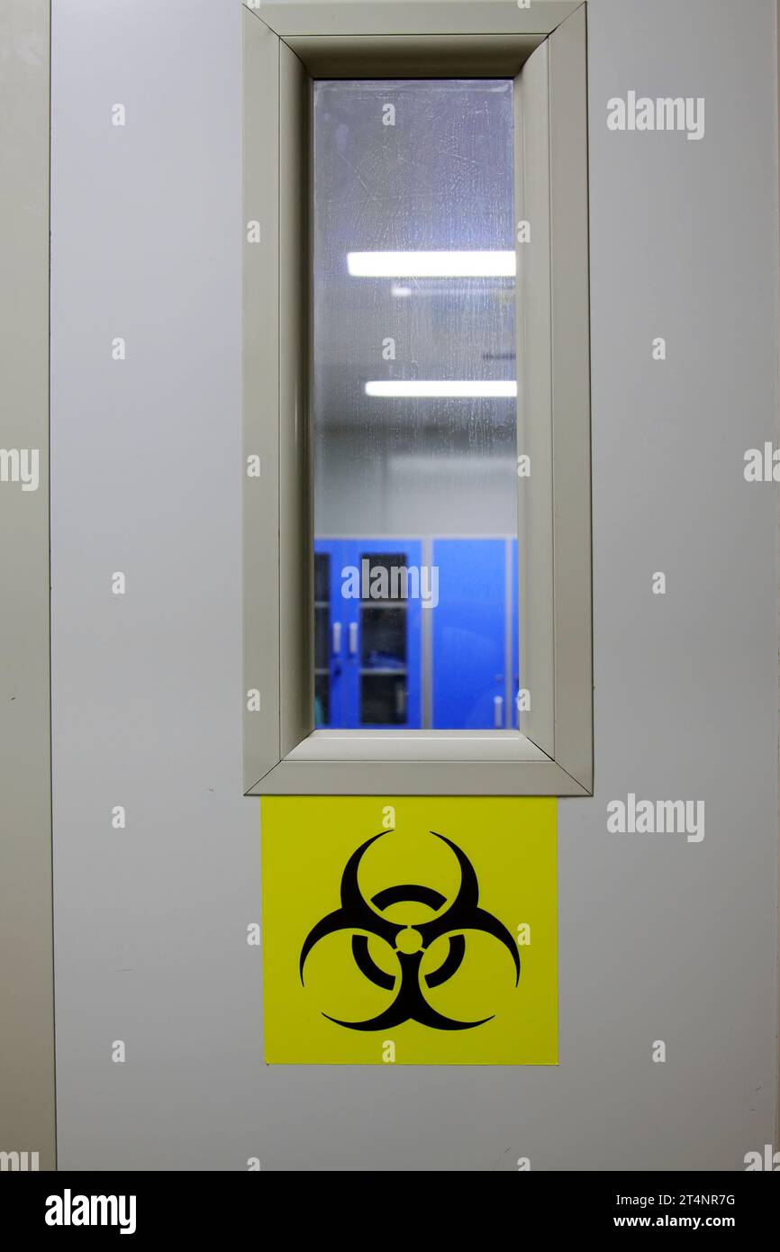Biohazard symbol on the door in hospital Stock Photo - Alamy